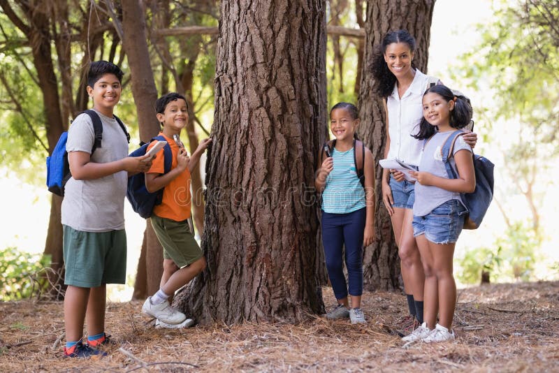 Happy Students and Teacher Standing by Tree Stock Photo - Image of ...