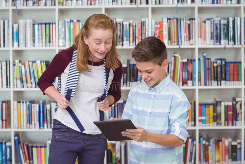 Happy Students Using Digital Tablet in Library Stock Image - Image of ...
