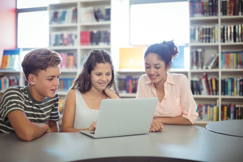 Happy Students Using Laptop in Library Stock Image - Image of browsing ...