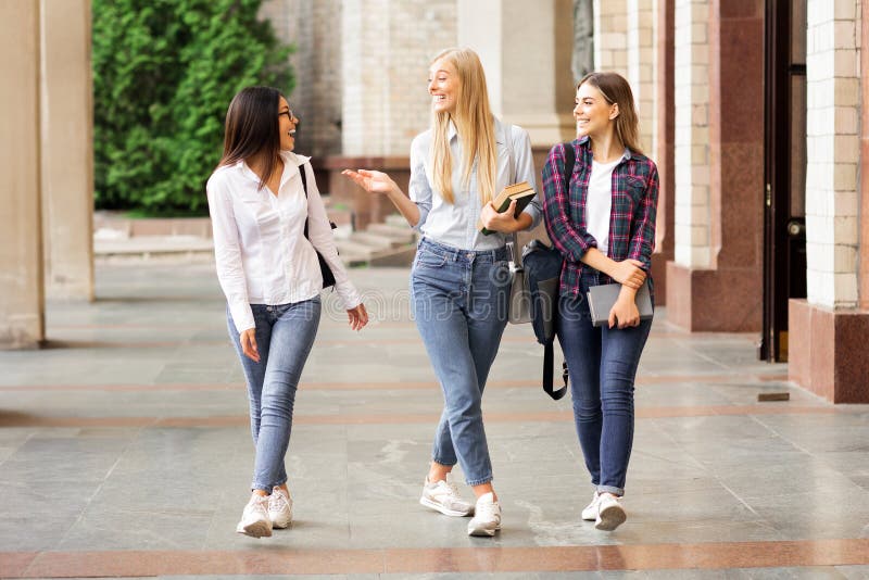 Happy Students Walking in University Hall during Break Stock Photo ...