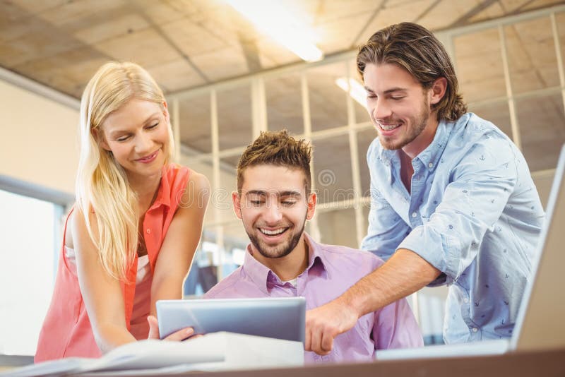 Happy Stylish Business People Looking at Digital Table Stock Image ...