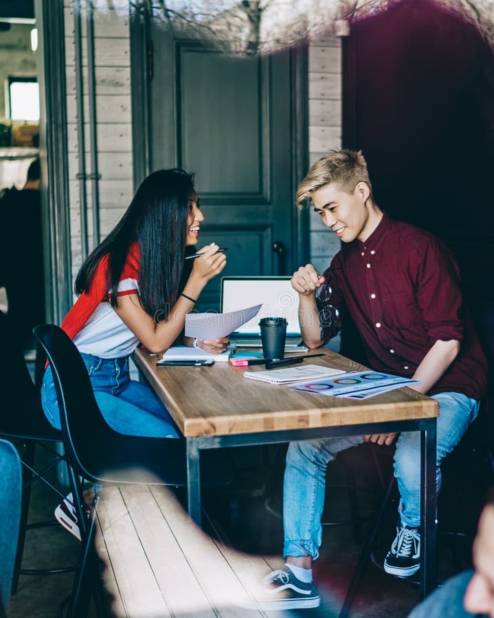 Happy Successful Colleagues Collaborating on Common Studying Task Stock ...