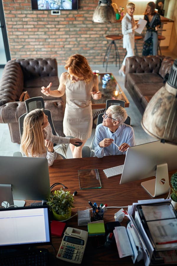 Happy Successful Women Discussing at the Office Stock Image - Image of ...