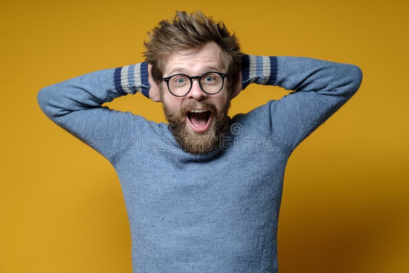 Happy, Surprised Man Screams with Joy while Holding His Hands Behind ... Happy, Surprised Man Screams with Joy while Holding His Hands Behind ...