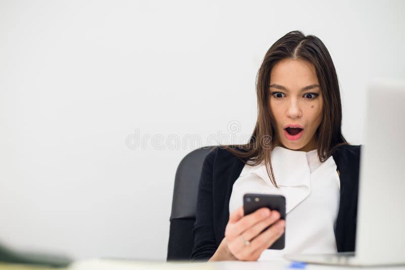Happy Surprising Woman Looking in Mobile Phone and Reading Message with ...