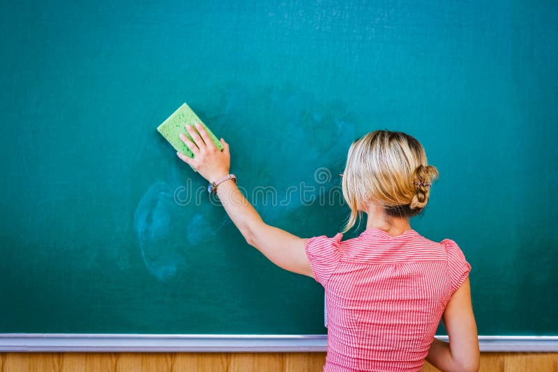 A Happy Teacher at the Blackboard in the Classroom Room Back To Class ...