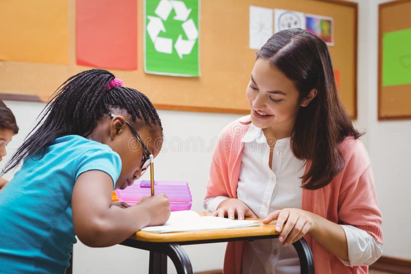 Happy Teacher Helping Her Students Stock Photo - Image of cute ...