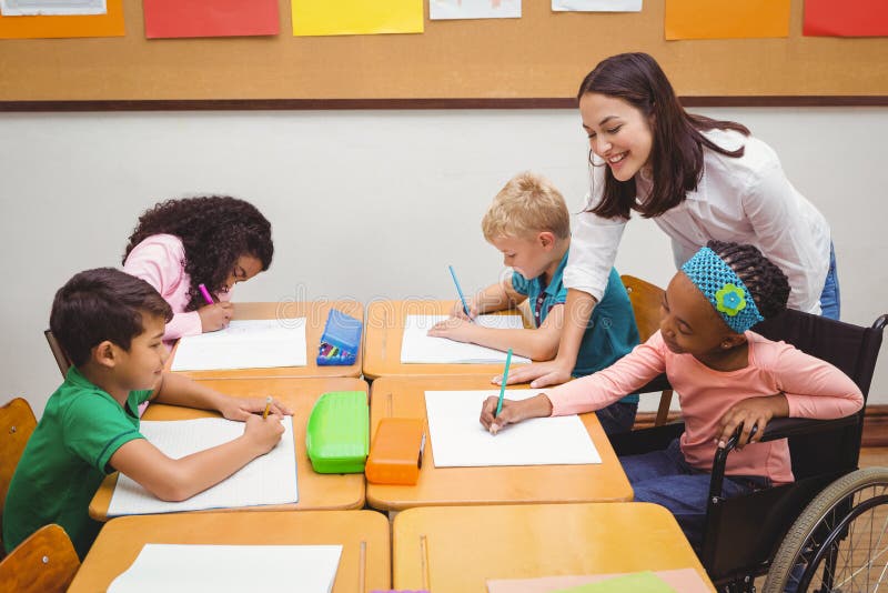Happy Teacher Helping Her Students Stock Image - Image of disability ...