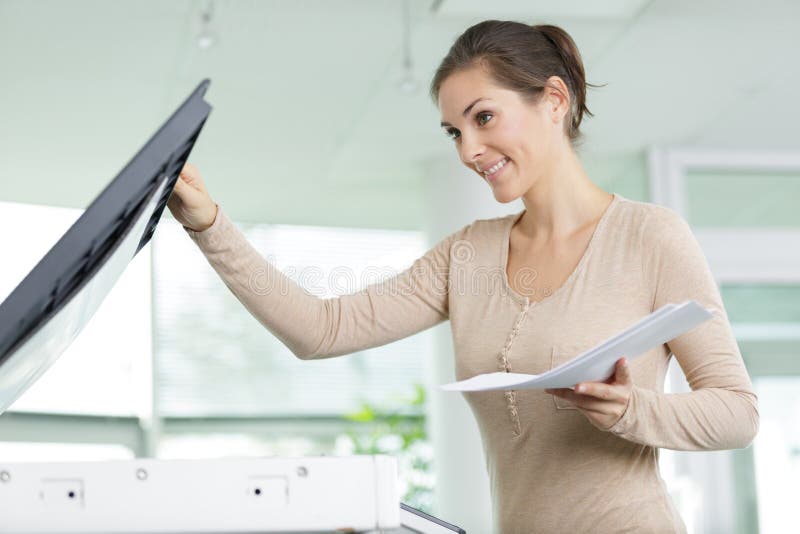 Happy Teacher Printing Off Work Sheets for Next Lesson Stock Photo ...