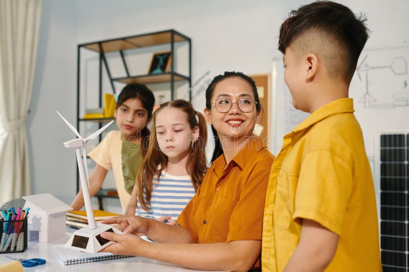 Students and Teacher Discussing Wind Turbine Stock Photo - Image of ...