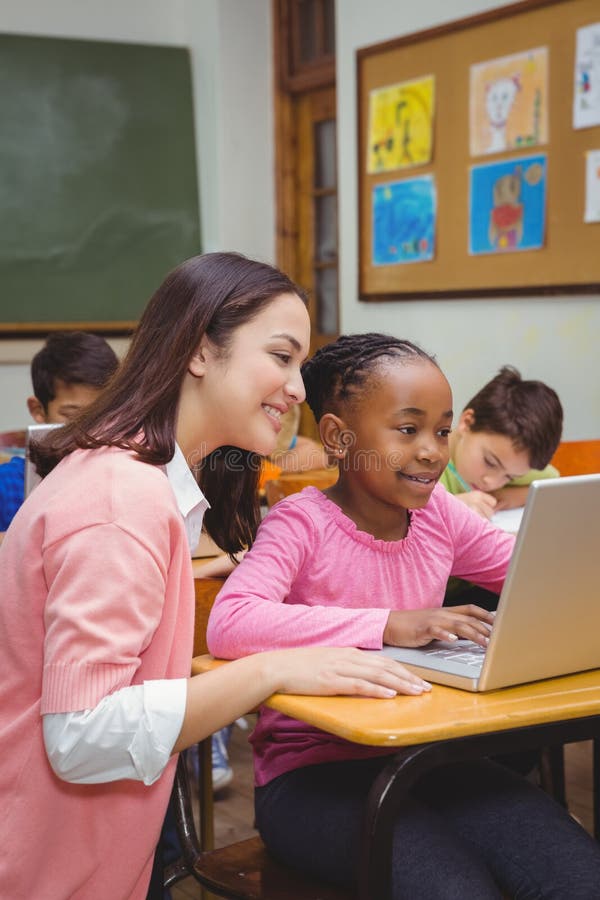 Happy Teacher Using Laptop with Student Stock Photo - Image of computer ...