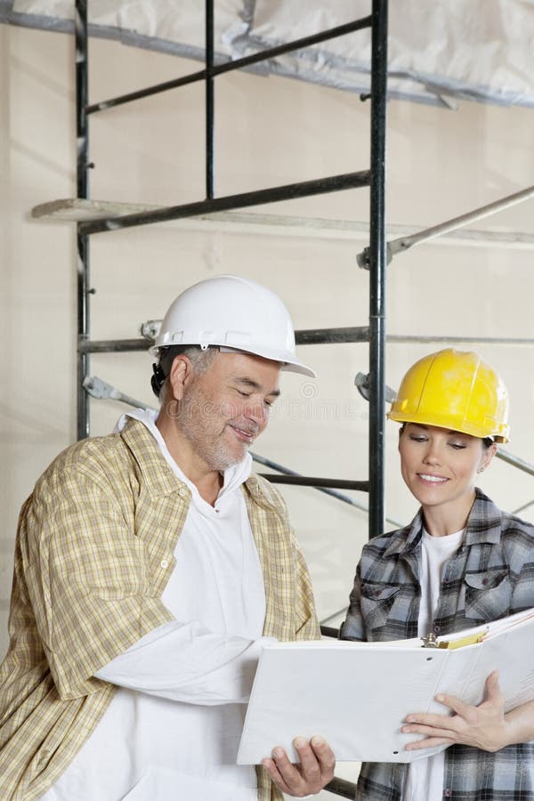 Happy Team of Architects Looking at Paper Stock Photo - Image of adult ...