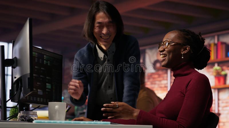 Happy Team Leader Joking with Employee Doing Code Testing in Relaxed ...