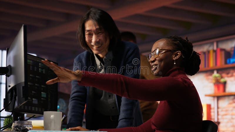 Happy Team Leader Joking with Employee Doing Code Testing in Relaxed ...