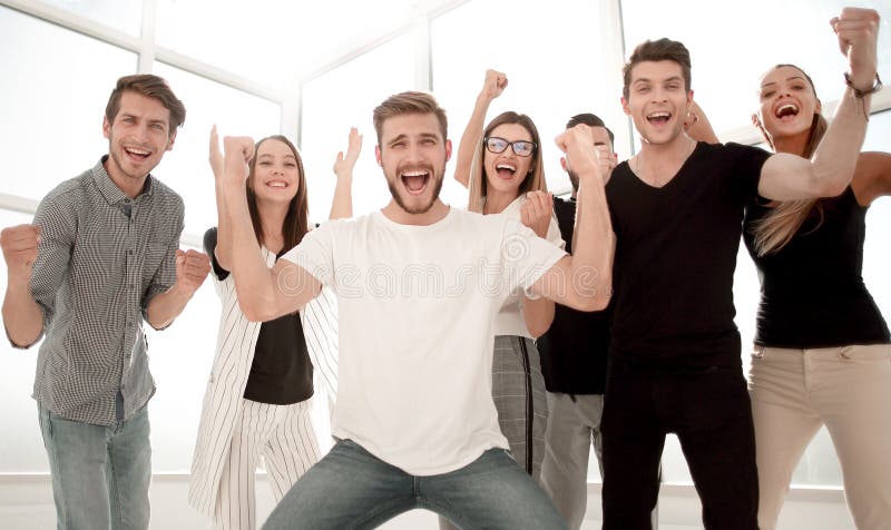 Happy Team of Young Employees Standing in the Office Stock Image ...