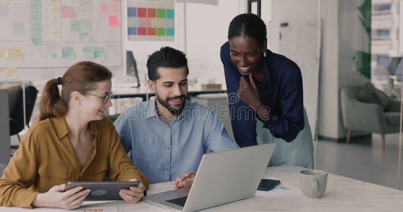 Happy Teammates Working on Task in Modern Office Using Laptop Stock ...