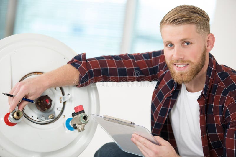 Happy Technician Servicing Boiler Holding Tools Stock Image - Image of ...