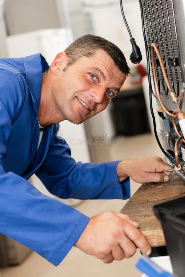 Happy Technician Smiling at Camera Stock Photo - Image of technician ...