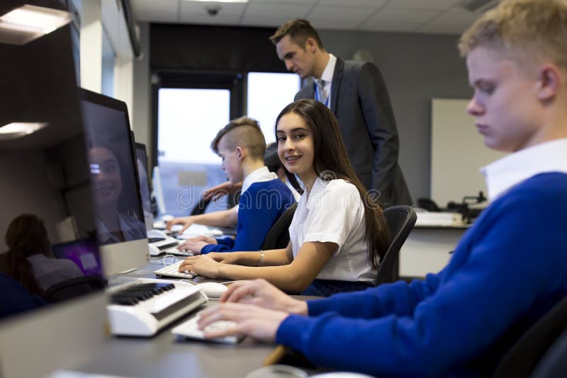 Pupils Wearing School Uniform in Computer Class Stock Photo - Image of ...