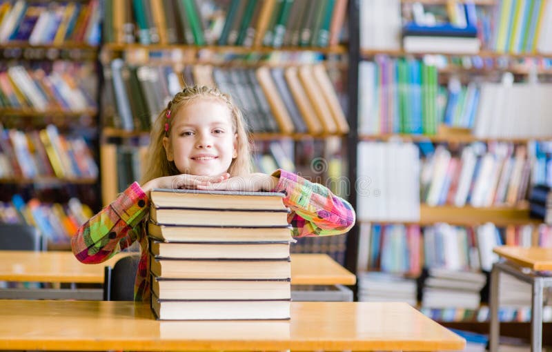 Happy teen girl in library stock image. Image of education - 73515907