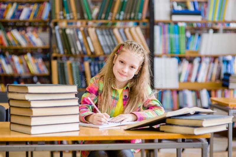 Happy Teen Girl Studying in the Library Stock Image - Image of ...
