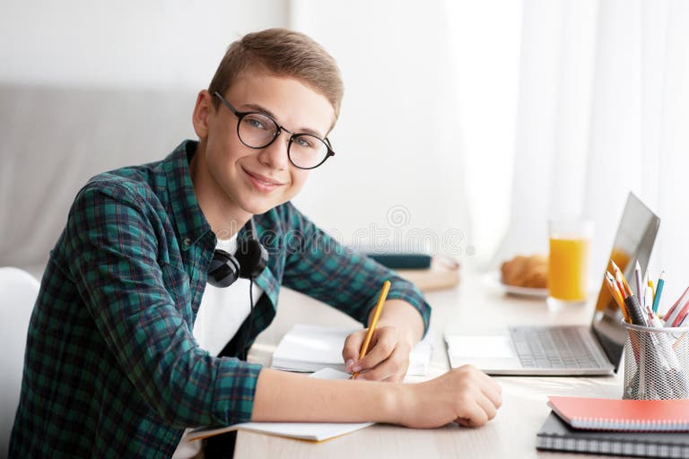 Happy Teen Guy Doing Homework at Home Stock Image - Image of notebook ...