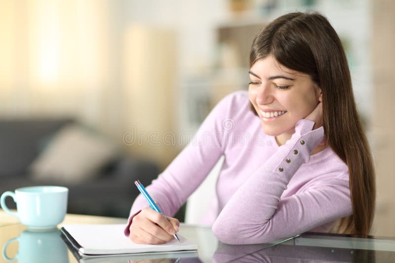 Happy Teen Writing on Notebook at Home Stock Image - Image of ...