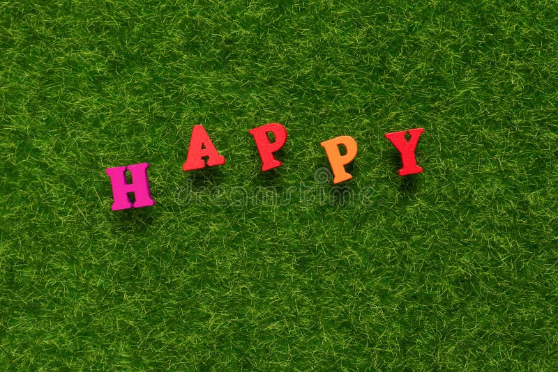 Happy Text on a Green Grass Stock Photo - Image of holiday, celebration ...
