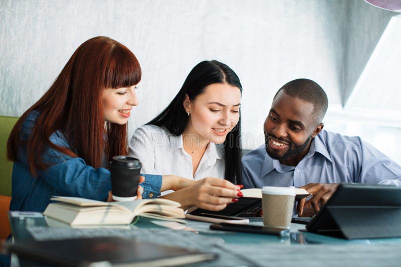 Happy Three Multiethnic Students Sitting at University Canteen with ...
