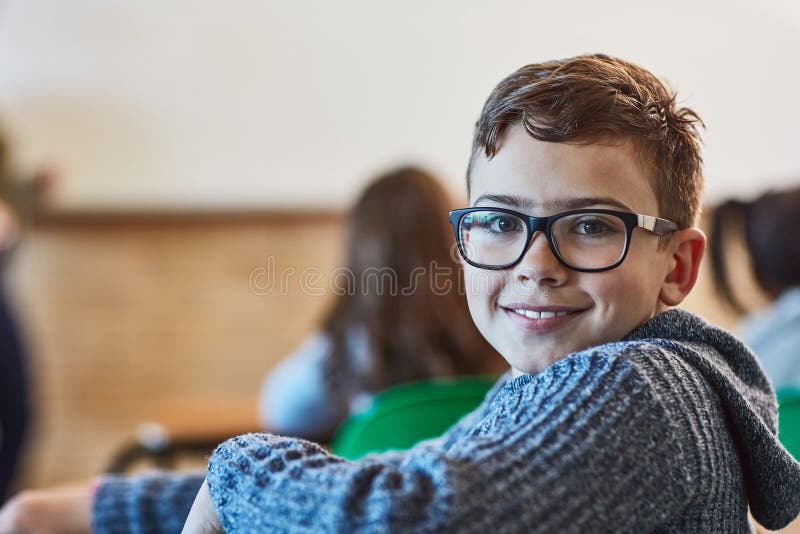 Happy To Be in Class. an Elementary School Boy in the Classroom. Stock ...