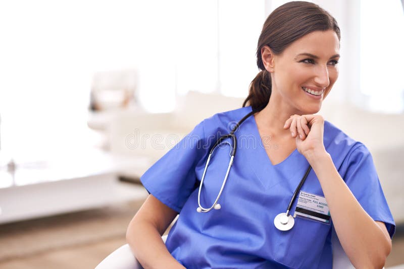 Happy To Heal. a Smiling Medical Practitioner in Scrubs. Stock Image ...