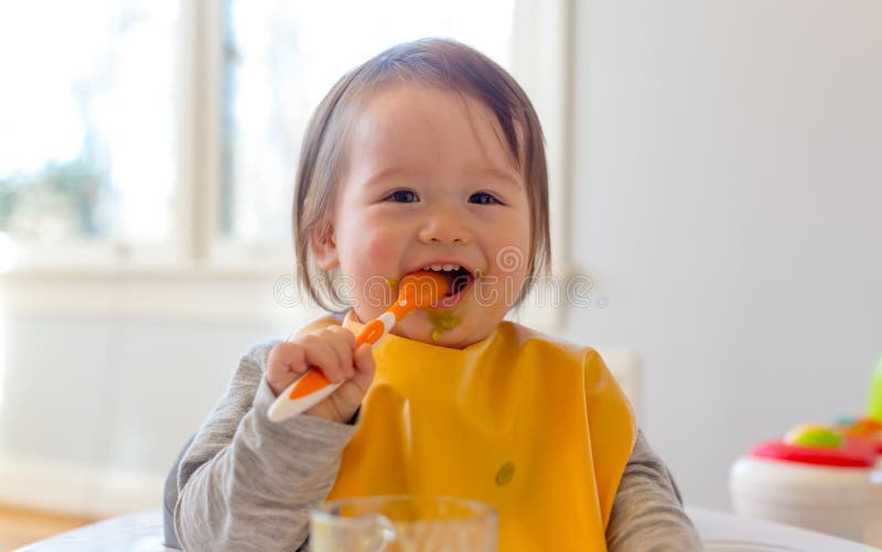 Happy Toddler Boy Eating a Meal Stock Image - Image of adorable ...