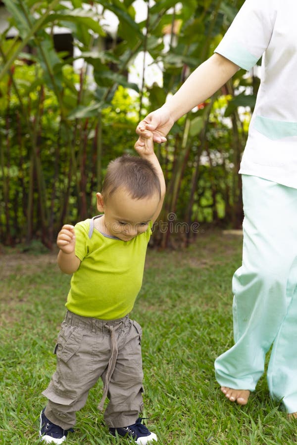 Happy Toddler Boy Learning To Walk Stock Photo - Image of hand ...