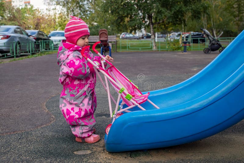 Happy Toddler Boy Playing on a Slide at a Playground Stock Image ...
