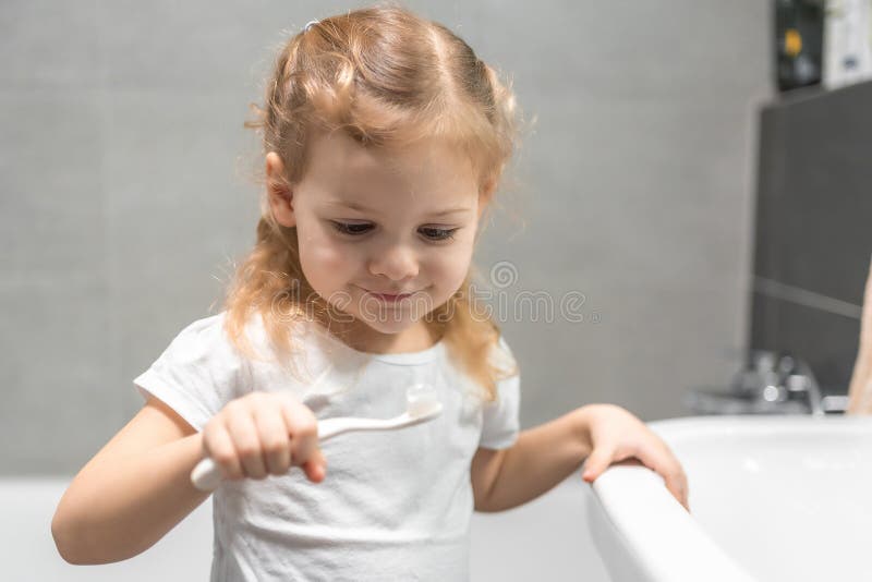 Happy Toddler Brushing Teeth in the Bath Stock Photo - Image of routine ...