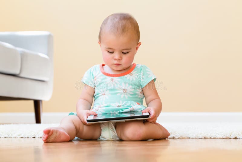 Happy Toddler Girl Playing with Her Tablet Stock Image - Image of ...