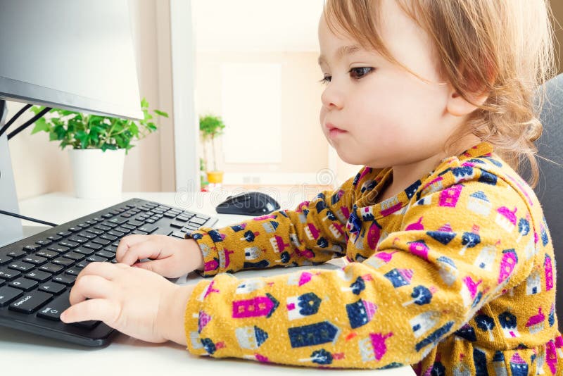 Happy Toddler Girl Typing on Her Computer Keyboard Stock Photo - Image ...