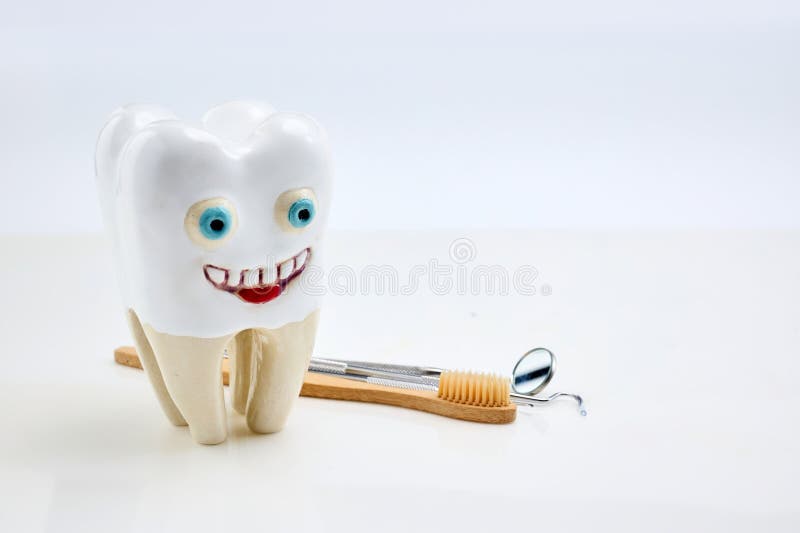 Happy Tooth. a Smiling Tooth Sculpture beside Dental Tools Stock Image ...