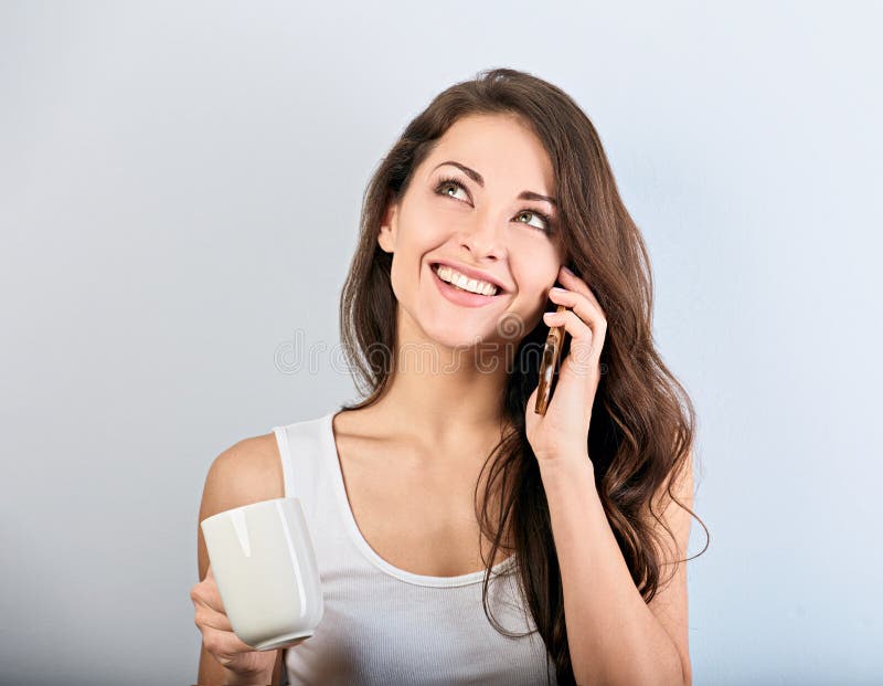 Happy Smiling Beautiful Woman Talking On Mobile Phone And Holding Cup