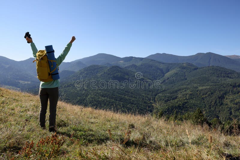 Happy Tourist with Backpack and Binoculars in Mountains on Sunny Day ...