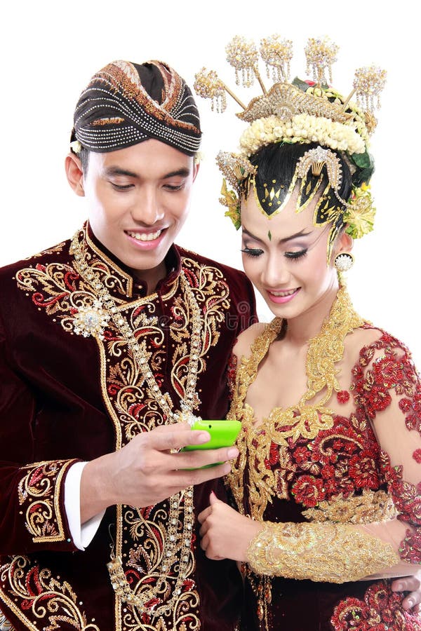 Happy Traditional Java Wedding Couple with Laptop Stock Photo - Image ...
