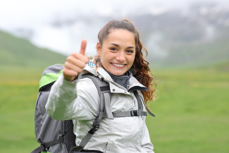 Happy Trekker Gesturing Thumbs Up at Camera in Nature Stock Image ...
