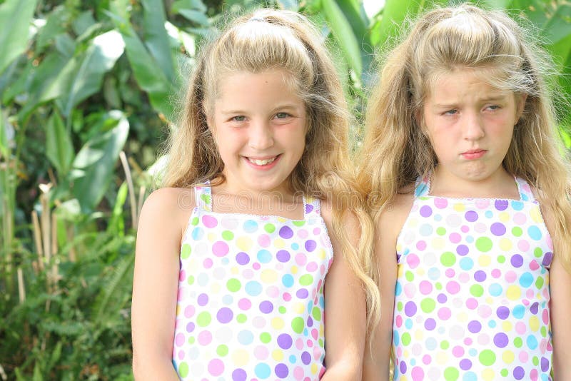 Happy twin sad sister stock photo. Image of people, nature - 6601046