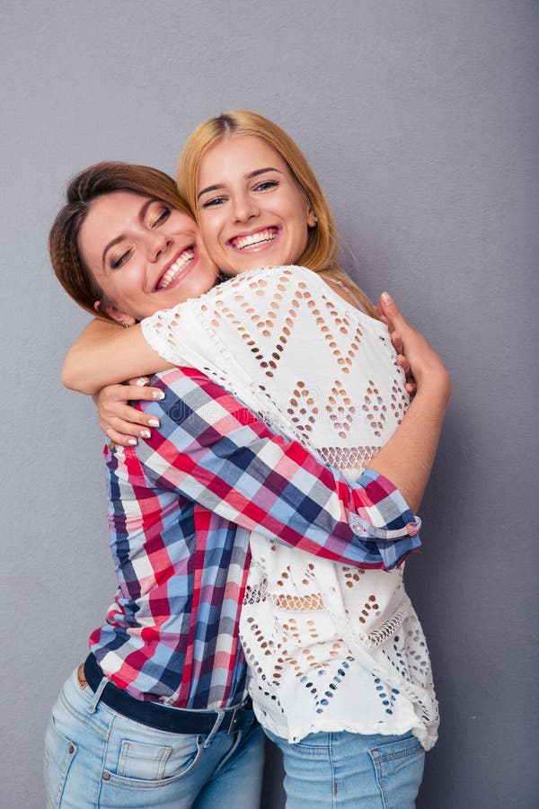 Happy two girls hugging stock photo. Image of women, hugging - 56389012