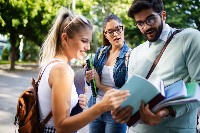 Happy University Friends Studying Together in College Stock Photo ...
