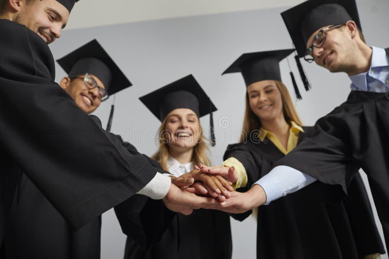 Happy University Graduates Join Stack Hands Stock Photo - Image of ...