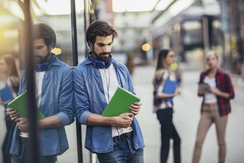 University Student Going on a Class at the University and Looking at ...