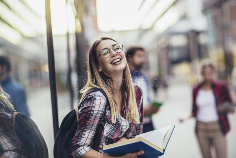 University Student Going on a Class at the University and Looking at ...