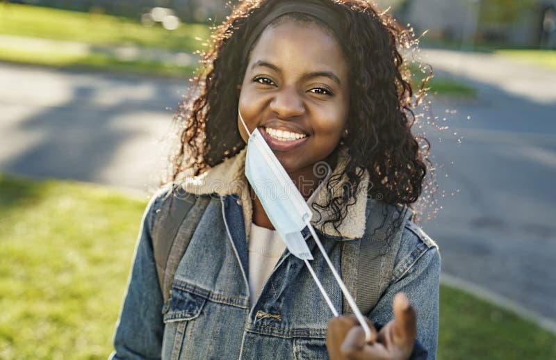 Happy University Student Taking Off Her Protective Face Mask Outside ...