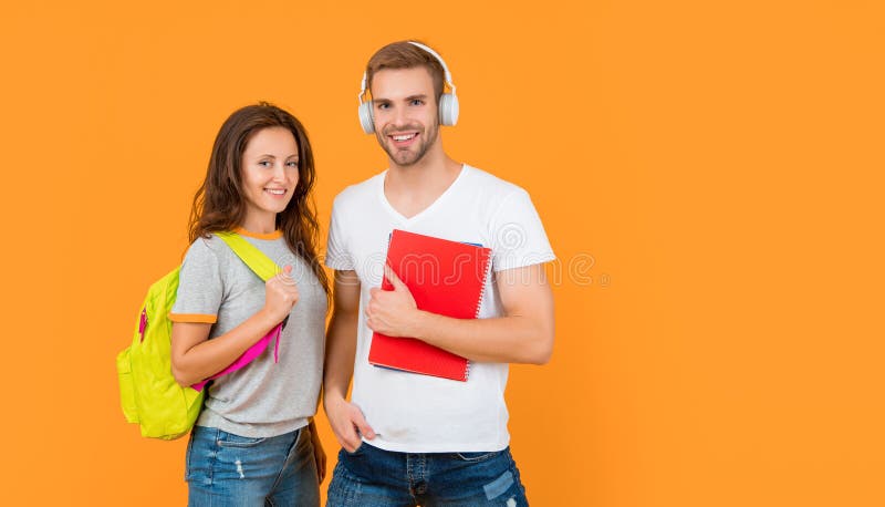 Happy University Students in Headphones with Workbook and Backpack with ...